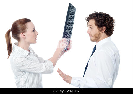 Man trying to explain, getting hit by keyboard Stock Photo - Alamy