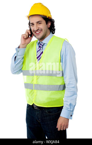 Smart young construction engineer attending call Stock Photo - Alamy