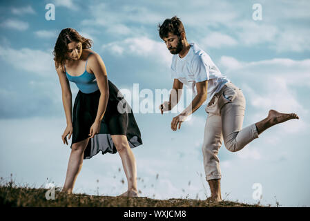 Cute couple of young hip-hop dancers. Young casual man and woman ...