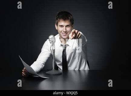 Anchorman smiling pointing at you Stock Photo - Alamy