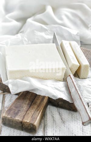 Greek feta block, brined cheese, in its opened original plastic wrap ...