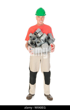 PVC pipes and tubes with green helmet isolated over white background ...