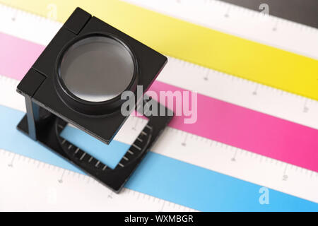 Printing loupe on proof CMYK color chart Stock Photo - Alamy
