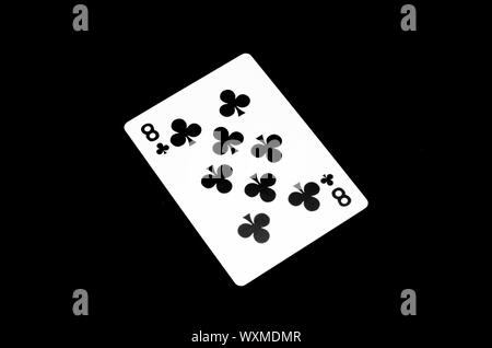 number eight clover card isolated on black background Stock Photo - Alamy