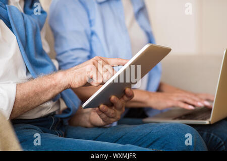 Tablet computer and gadgets on grey grunge background. Concept of ...