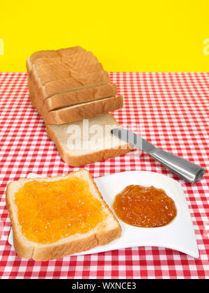 Strawberry jam yellow peach bread with doughnuts Stock Photo - Alamy