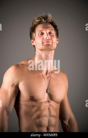 Blond athletic man with well developed abs and pecs Stock Photo - Alamy
