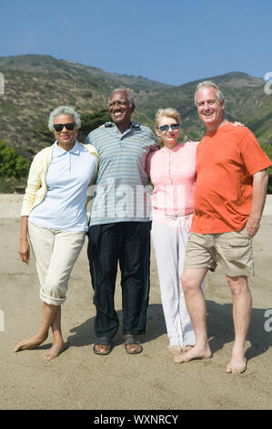 Two mature couples embracing Stock Photo - Alamy
