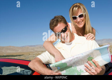 Woman road tripping and looking at the map. Travel by car Stock Photo ...