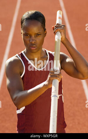 Female athlete preparing for pole jump Stock Photo - Alamy