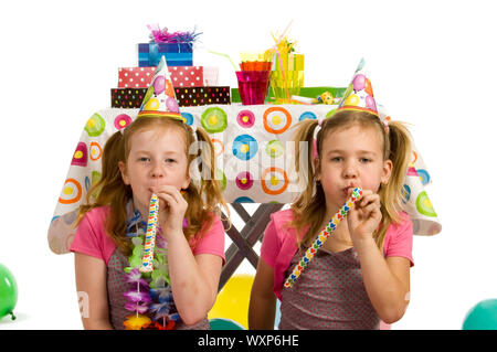 happy girls with blowers on birthday party Stock Photo - Alamy
