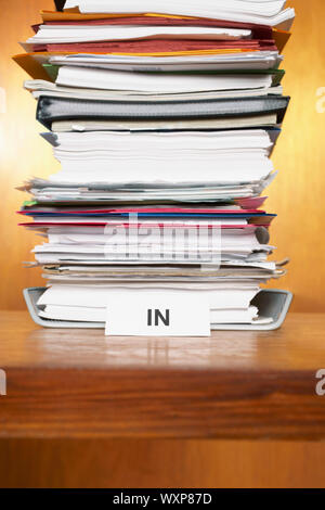 Overflowing paper inbox Stock Photo - Alamy