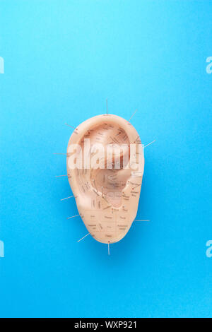 Acupuncture pins in model ear Stock Photo - Alamy
