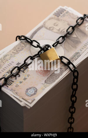 Money Wrapped in Chains Stock Photo - Alamy