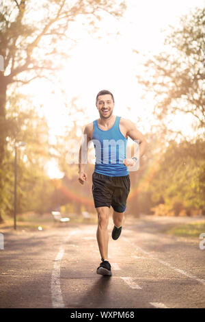 Outdoor portrait of muscular young man Stock Photo - Alamy