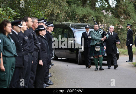 Police officers form a Guard of Honour at Pudsey Parish Church near ...