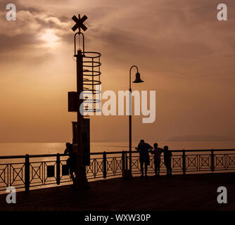 A fisherman is silhouetted during a sunset in Split, Croatia on January ...