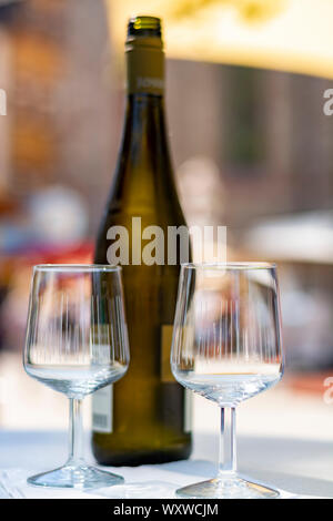 Tasting of cold white dry riesling wine on street wine festival on ...