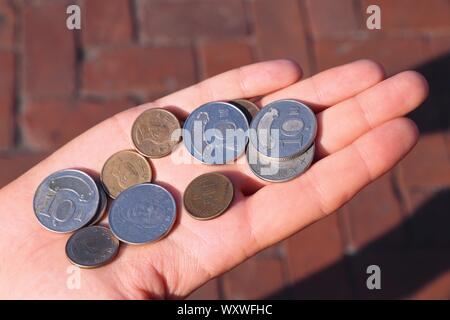 New Taiwan dollars currency - hand holding 100, 500 and 1000 NTD ...