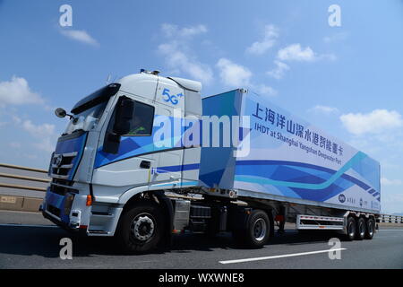 A 5G-featured container truck of IHDT (Intelligent Heavy-Duty Truck) of ...