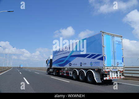 A 5G-featured container truck of IHDT (Intelligent Heavy-Duty Truck) of ...