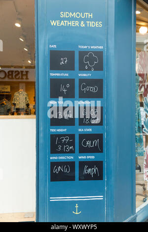 Tide times displayed on blackboard on hut on Whitby swing bridge Stock ...