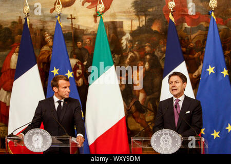 France's President Emmanuel Macron, left, welcomes Slovakia's Prime ...