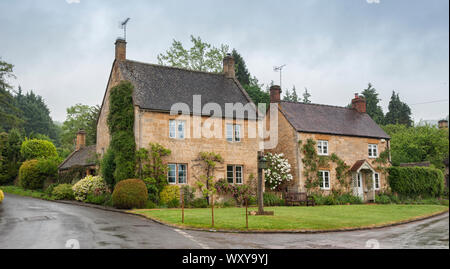Typical limestone built Cotswold house cottage family home with quaint ...