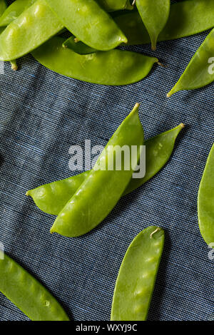 Snow peas are a legume in which both the peas and the pod are edible ...