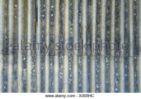 Corroded and rusty corrugated metal roof panels lit diagonally Stock ...