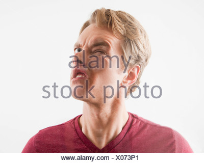 Man pushing his face against glass Stock Photo - Alamy