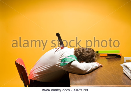 one caucasian business man Stabbed in the Back in silhouette on white ...