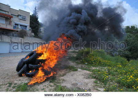 Burning tyres. Tyres are burnt as part of a demonstration to block ...
