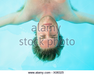 Man floating upside down above Earth graphic Stock Photo: 25029056 - Alamy