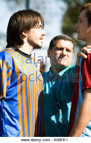Soccer players arguing with referee on field Stock Photo: 66453776 - Alamy