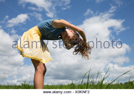 Teenage girl bending forward with hands in hair Stock Photo: 62469937 ...