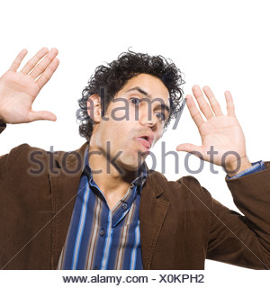 Man with face pressed up against window, studio shot Stock Photo ...