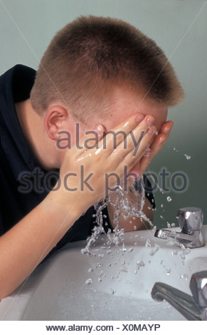 Teenage boy washing face Stock Photo: 30322357 - Alamy