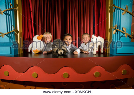 School kids doing puppet show in theatre at library Stock Photo ...