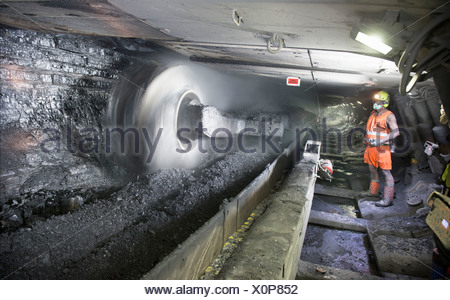 Mine worker with helmet and full body coal dust Stock Photo - Alamy
