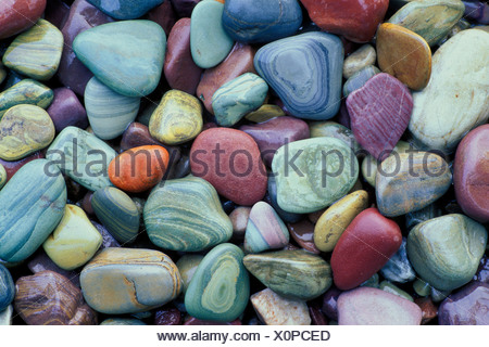 Colorful pebbles at the shore of McDonald Lake Glacier National Park ...