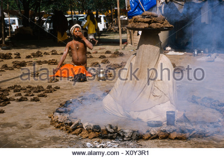 Dhuni Tapa, symbolic self-sacrifice of sadhus to Agni, the God of Stock ...