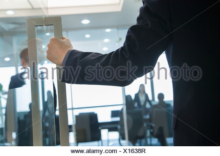 Business people entering into conference room Stock Photo: 74799844 - Alamy