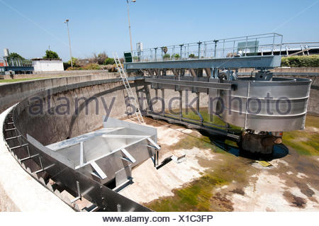 Sewage treatment plant. Primary sedimentation basin, sewage flowing ...