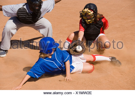 Baseball player sliding into home plate Stock Photo: 20250593 - Alamy