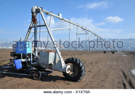 Agriculture - A mobile sprinkler irrigation system irrigates a Stock ...