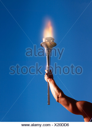 Male athlete holding up torch Stock Photo: 42056710 - Alamy