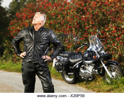 Older man in leather on motorcycle Stock Photo: 48818339 - Alamy