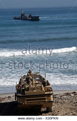 Improved Navy Lighterage System (INLS) Warping Tug 11 hip tows the INLS ...