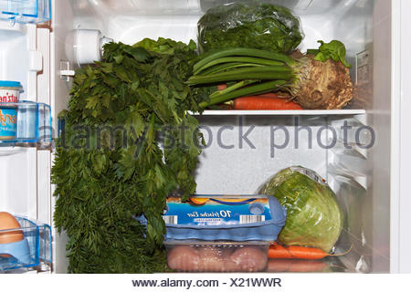 Food stored in the wrong place in a fridge, uncovered meat Stock Photo ...